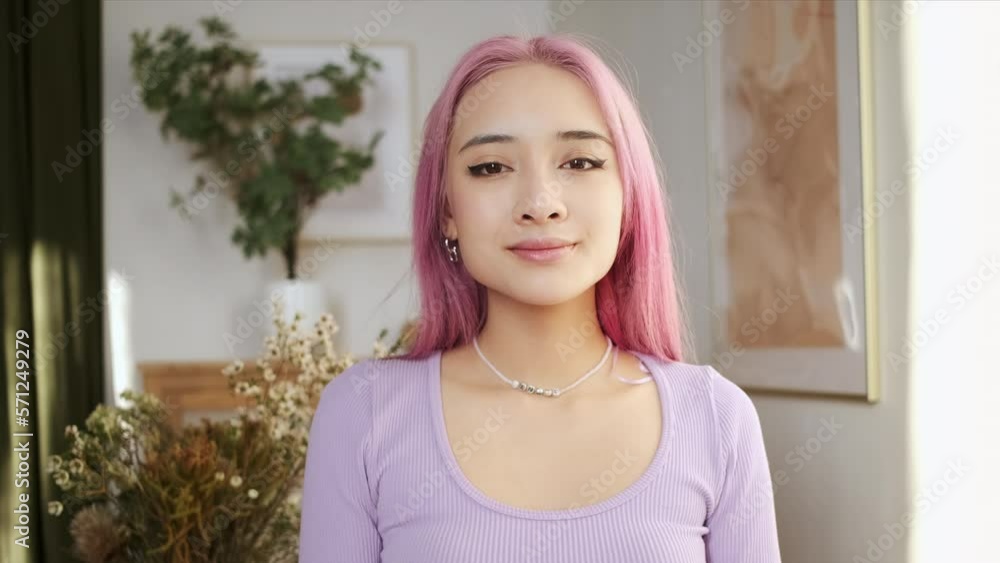 Beautiful smiling confident young asian ethnic woman face looking at ...