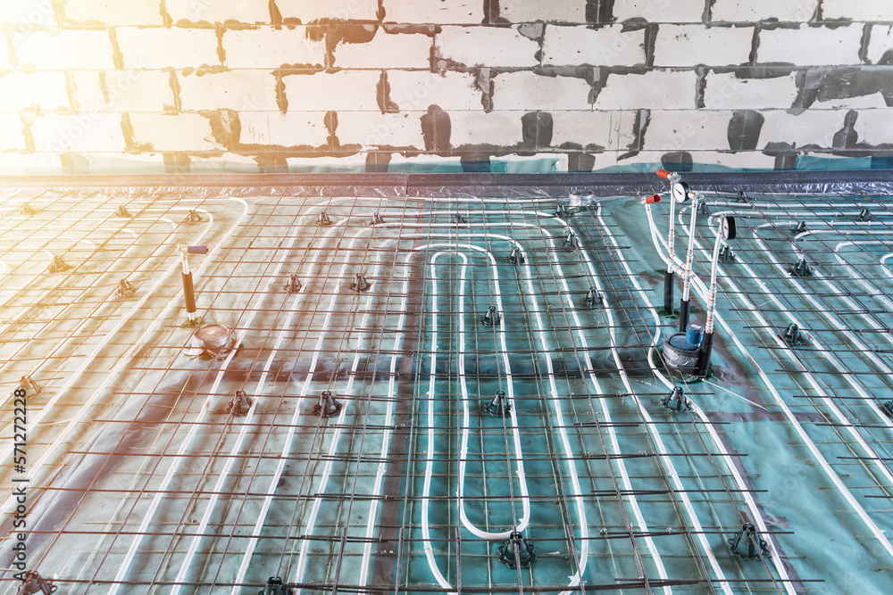 Underfloor heating pipes installation on construction site Stock Photo ...