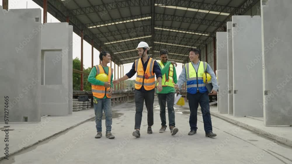 Engineers are inspecting work inside a precast concrete factory ...