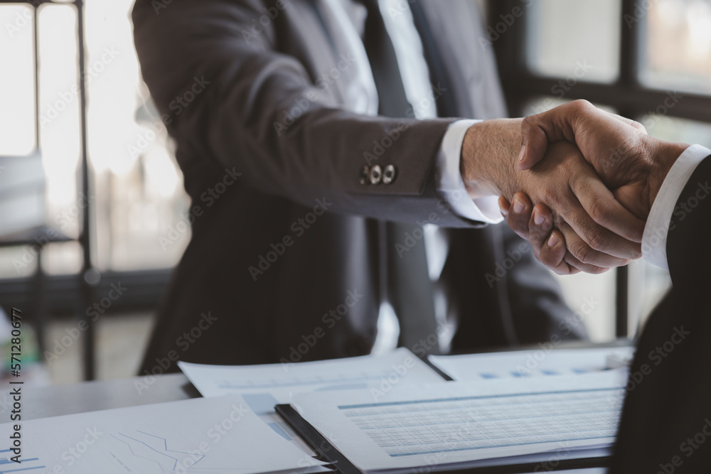 Business investor group holding hands, Two businessmen are agreeing on ...