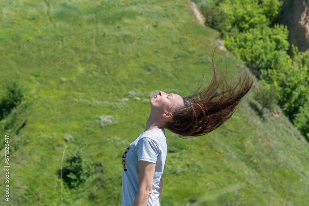Foto de Movement raise on head hair up in the air. Portrait carefree ...