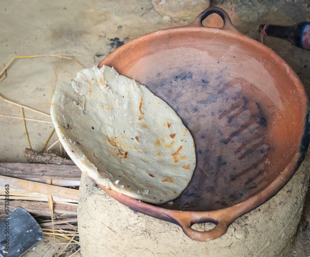 rice floor bread making in traditional soil vessels at wood fire from ...