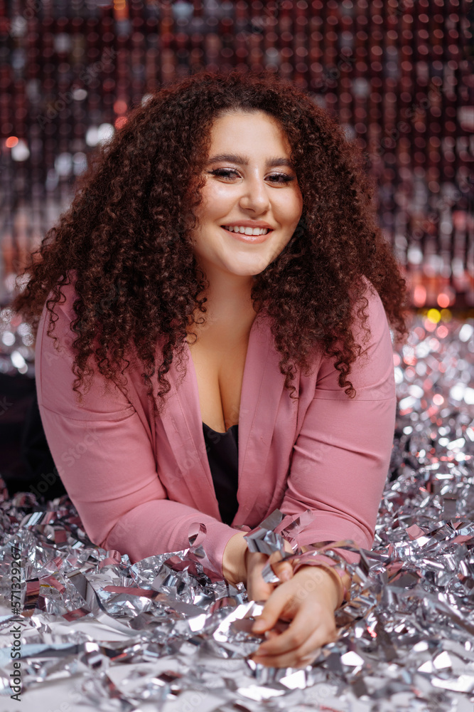 Beautiful, confident woman plus size model in a pink cape and black ...
