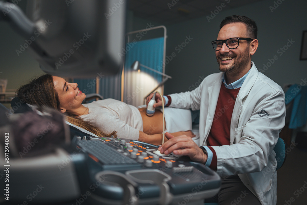 Sonographer using ultrasound machine at work. Modern clinical ...