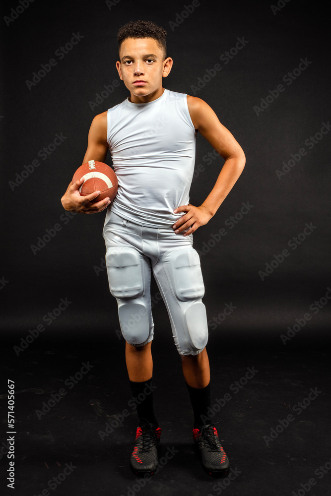 Youth Preteen Boy Football Player Holding Football in Studio Stock ...