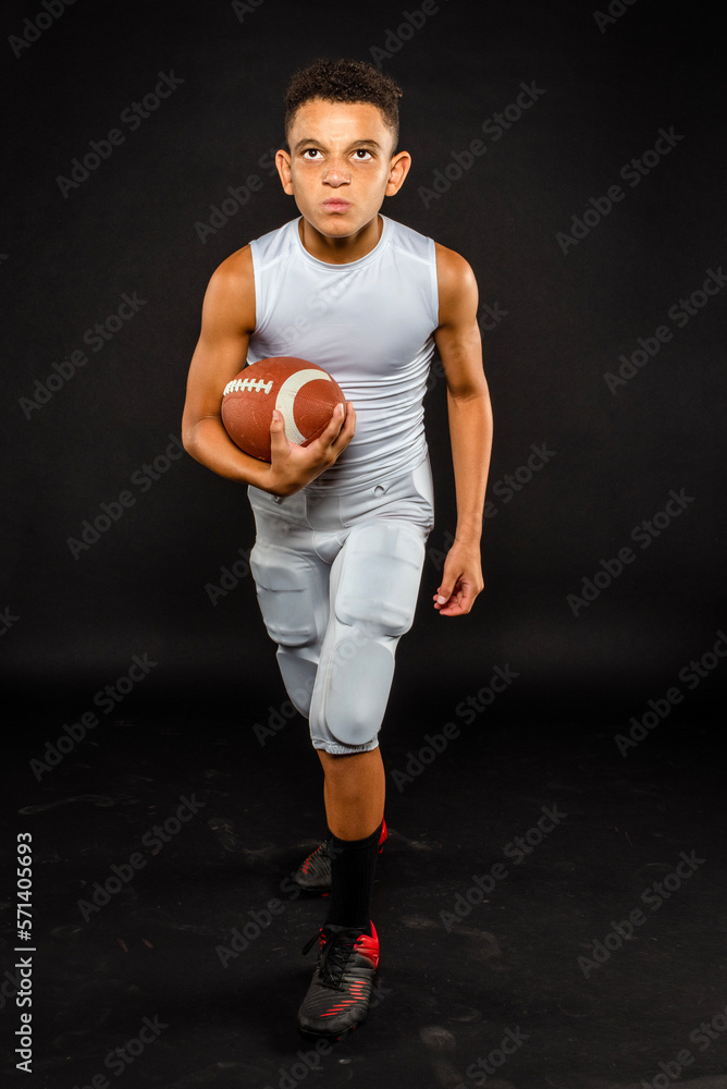 Youth Preteen Boy Football Player Holding Football in Studio Stock ...
