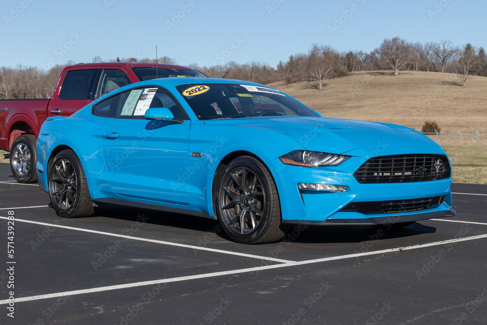 Ford Mustang display at a dealership. Ford offers the Mustang in a base ...