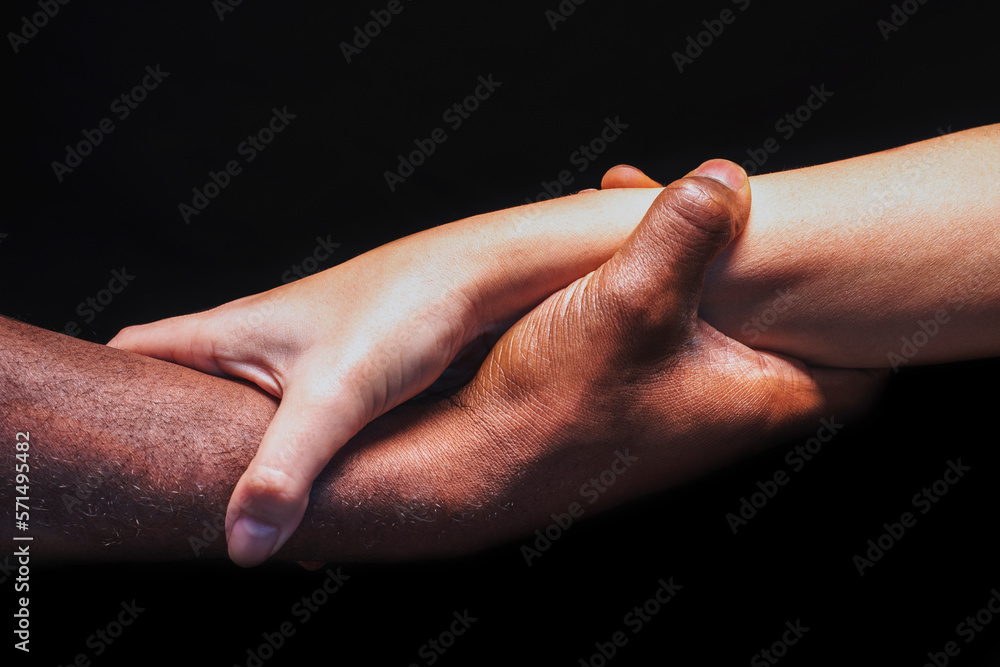 Male and female hands with different skin tones holding each other ...