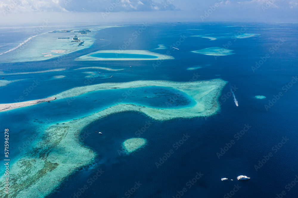 Aerial view of beautiful Atolls with barrier Reef surrounded by the ...