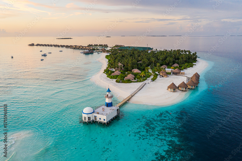 Aerial view of bungalows and a lighthouse of a luxury resort, Laccadive ...