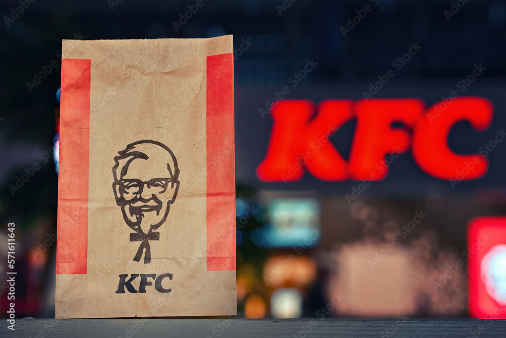 Fotka „Minsk, Belarus. Sep 2022. KFC Paper bag in front of luminous KFC ...