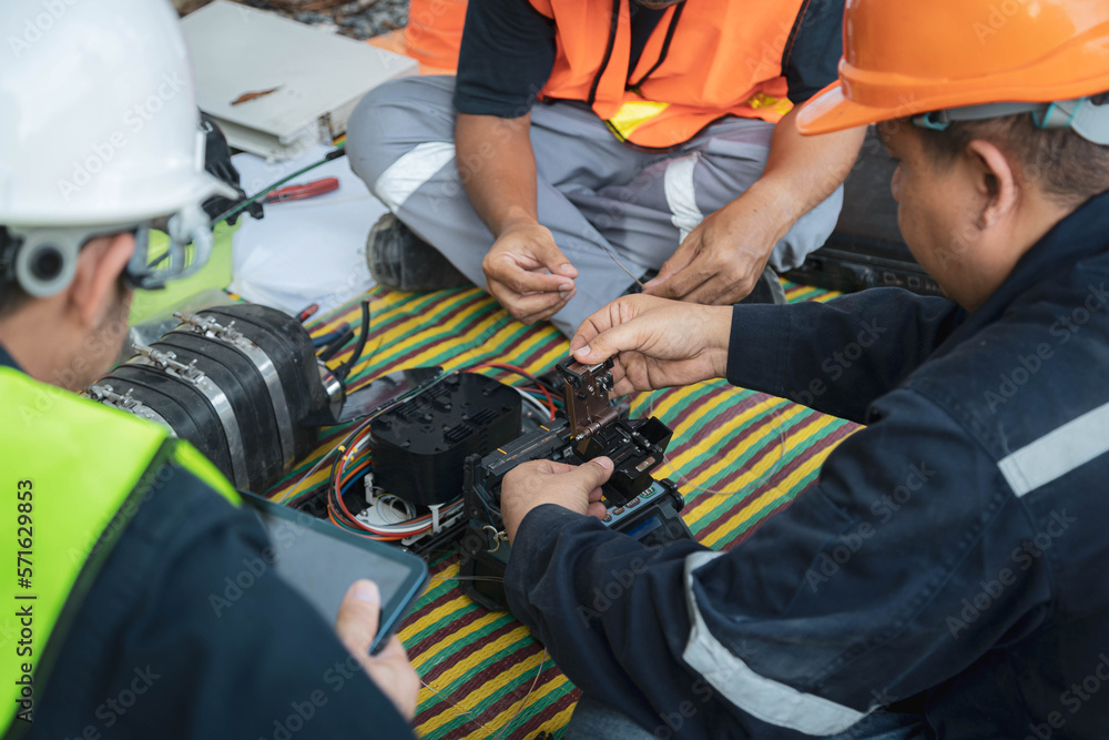 Engineer is inspecting connecting fiber optic and optical distribution ...