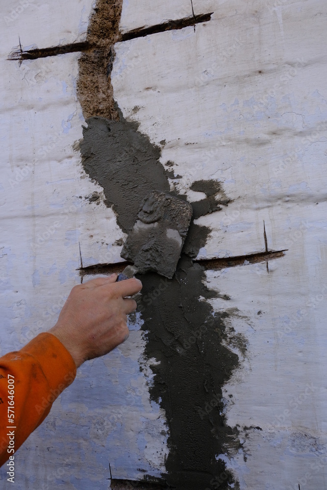 House crack repair. Strengthening the foundation of the house after the ...
