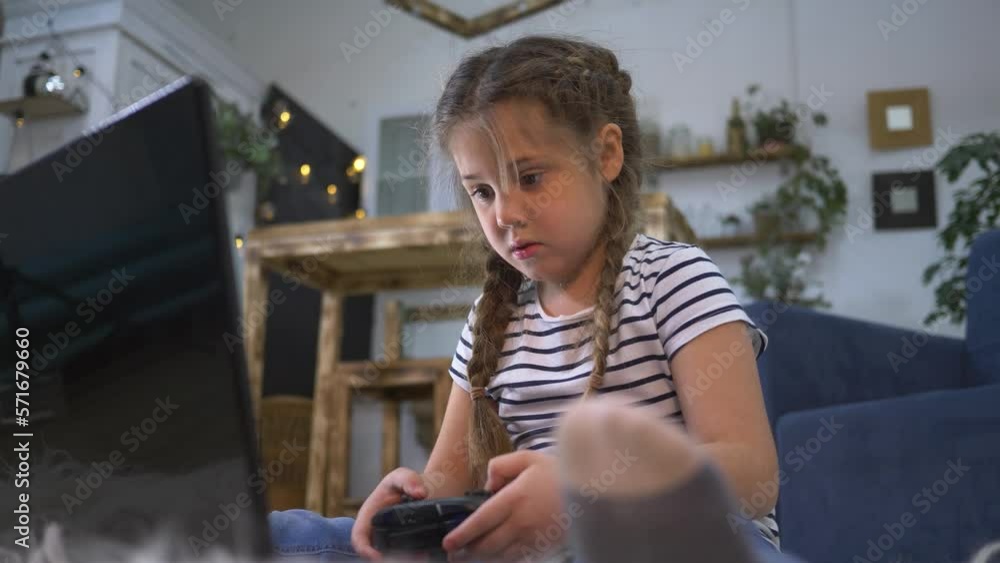 People playing video games. Happy cute kid gamer playing video game ...