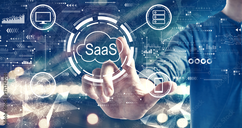 SaaS - software as a service concept with a man on blurred city background Stock Photo | Adobe Stock