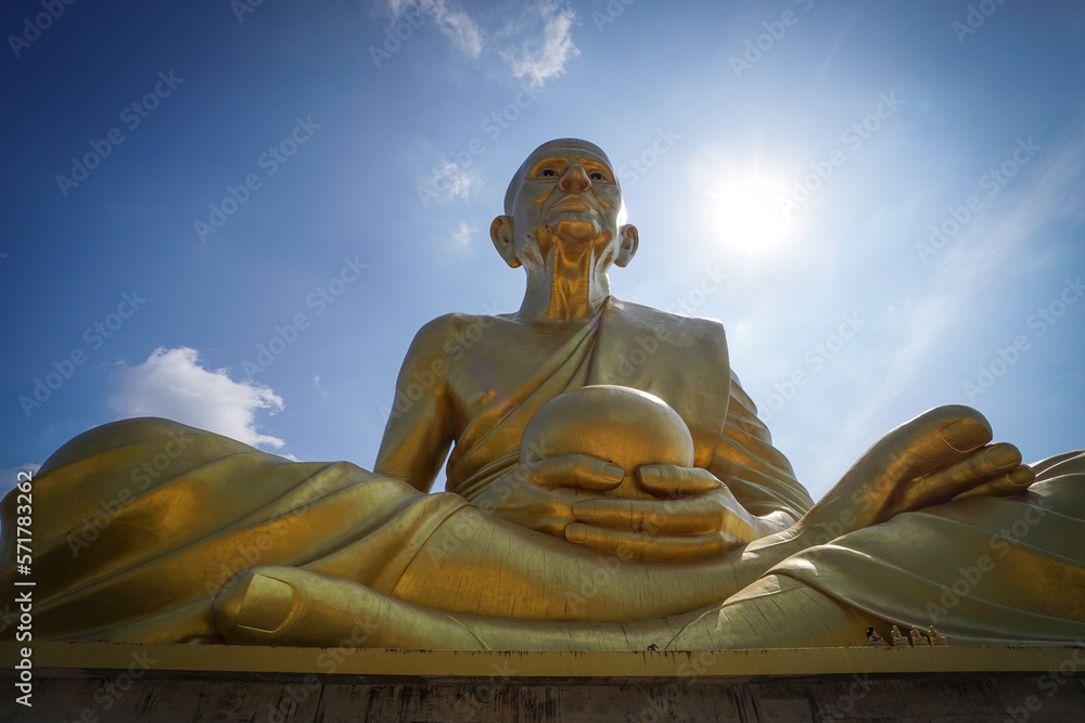 Golden Buddhist statues and carving showing intricate details and ...