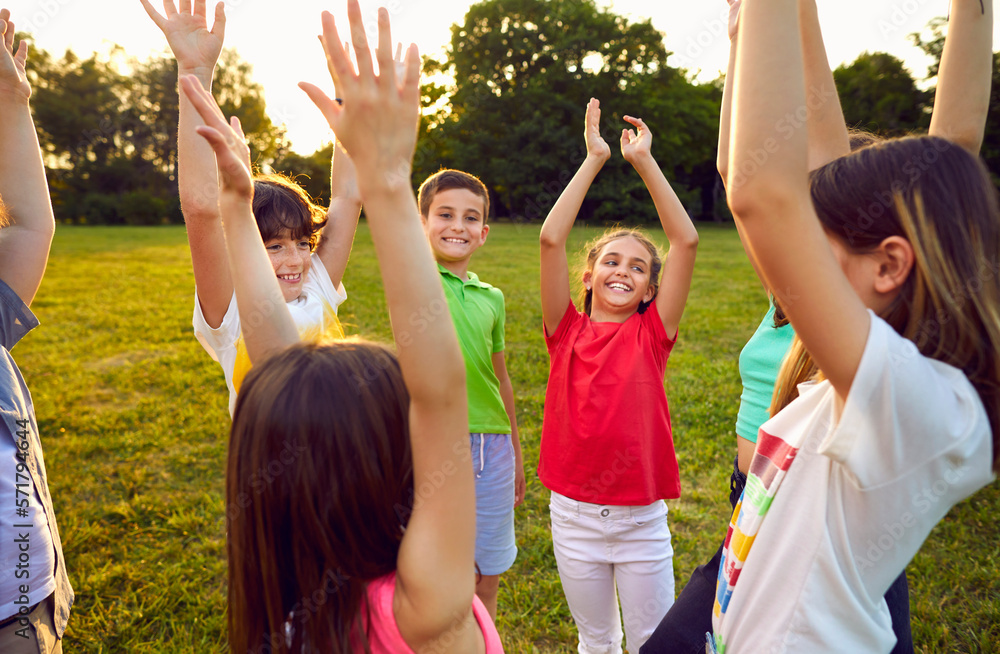 Children having fun in the park. Happy kids playing all together. Group ...