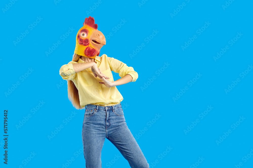 Woman in funny strange crazy disguise dancing isolated on solid blue ...