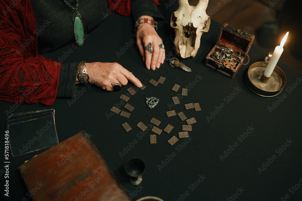 Old mature witch giving prediction using spiritual attributes closeup ...
