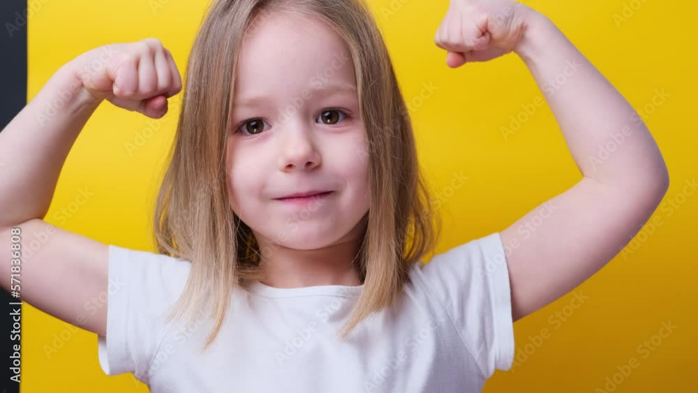 Strong power preschool little girl flexing arm muscle smile posing ...
