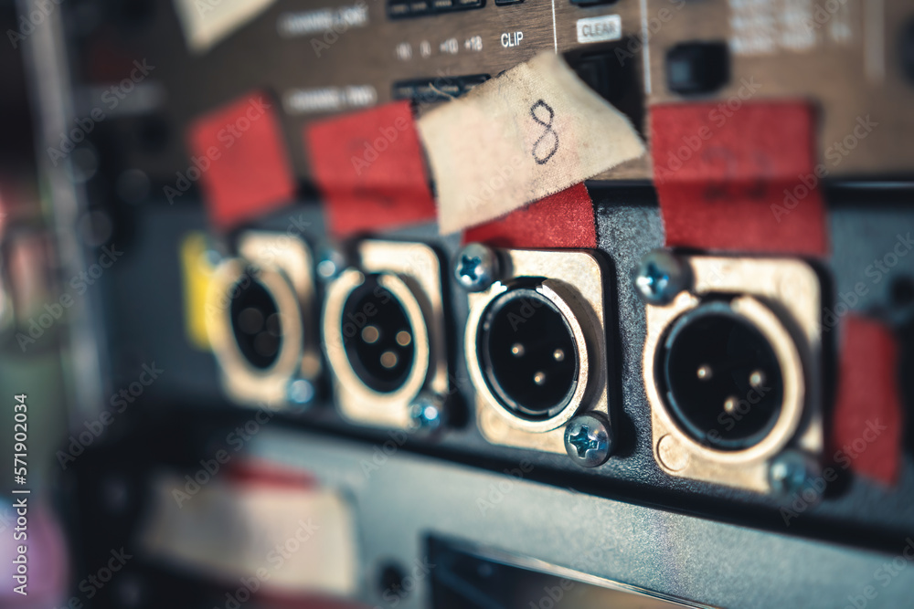 Music mixer panel with microphone connector ports in recording studio ...