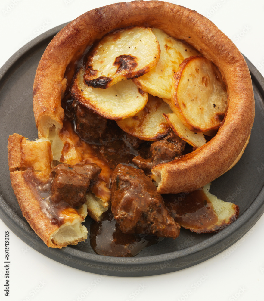 Yorkshire pudding filled with beef and potatoes Stock Photo | Adobe Stock