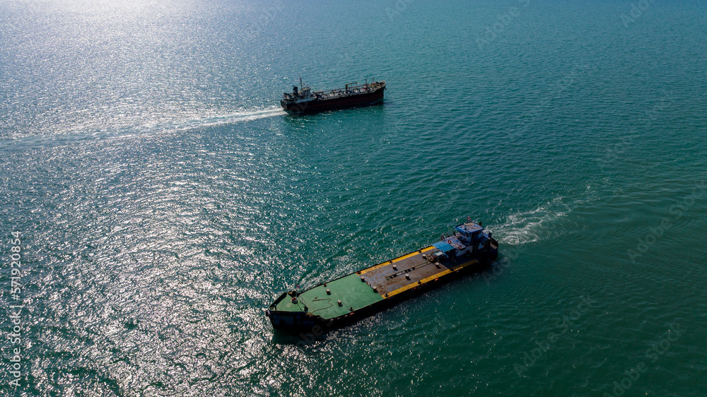 Oil Ship tanker or Liquid fied Petroleum Gas (LPG) sailing in green sea ...