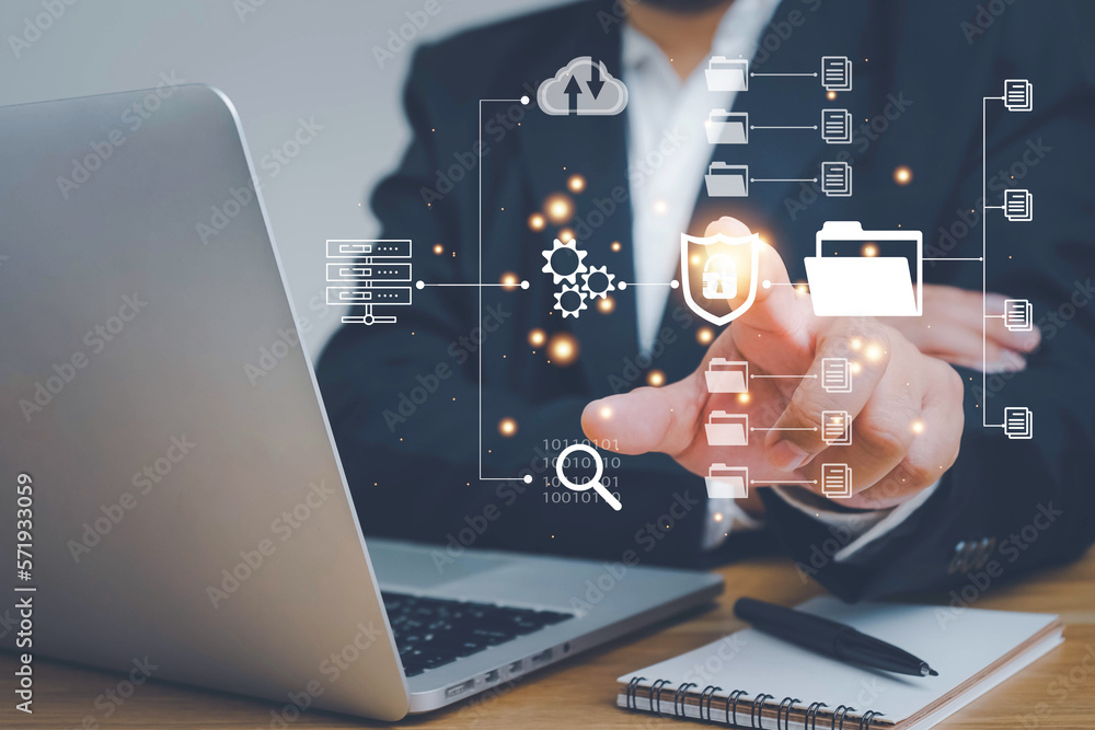 Document management system concept, Businessman pointing folder icon on virtual screen data ...