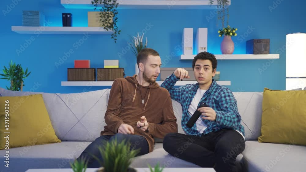 Funny young brothers fighting over watching TV at home. Sibling ...