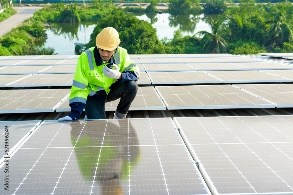 worker with safety helmet checking and operating system at solar cell ...