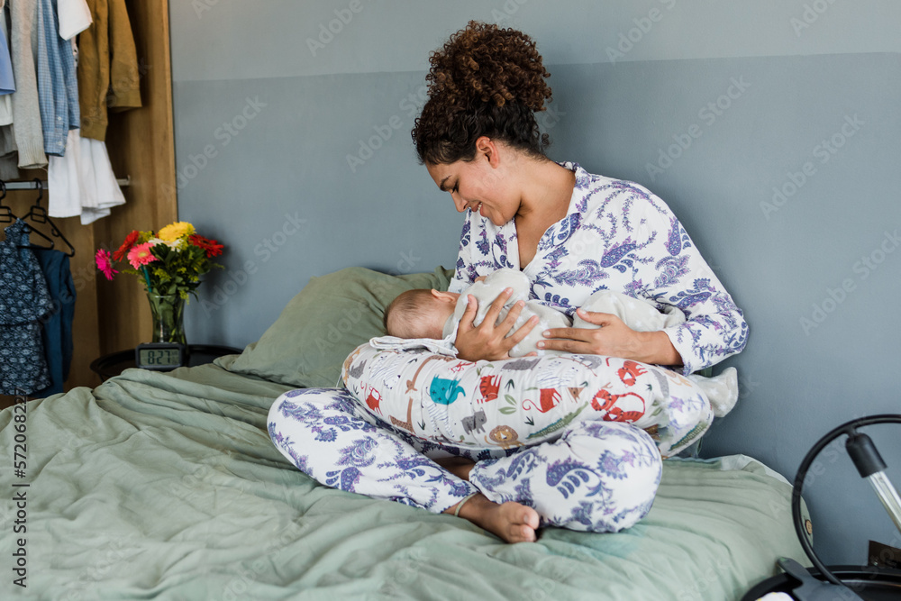 hispanic mom breastfeeding her newborn baby at home in Mexico Latin America Stock Photo | Adobe ...