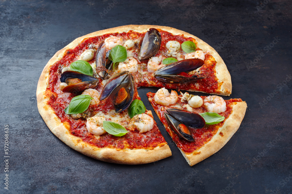 Traditional Italian pizza frutti di mare with king prawns, blue mussels ...