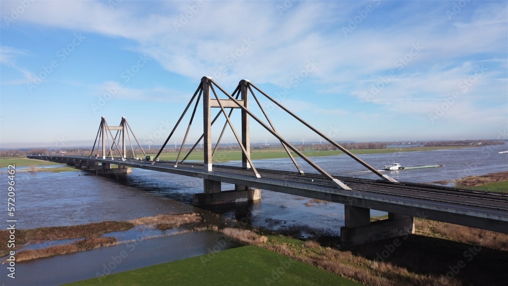 Bridge with motorway the Willem Alexander bridge over the river Maas ...