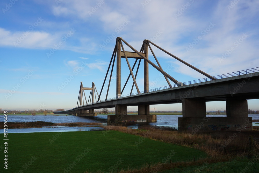 Bridge with motorway the Willem Alexander bridge over the river Maas ...