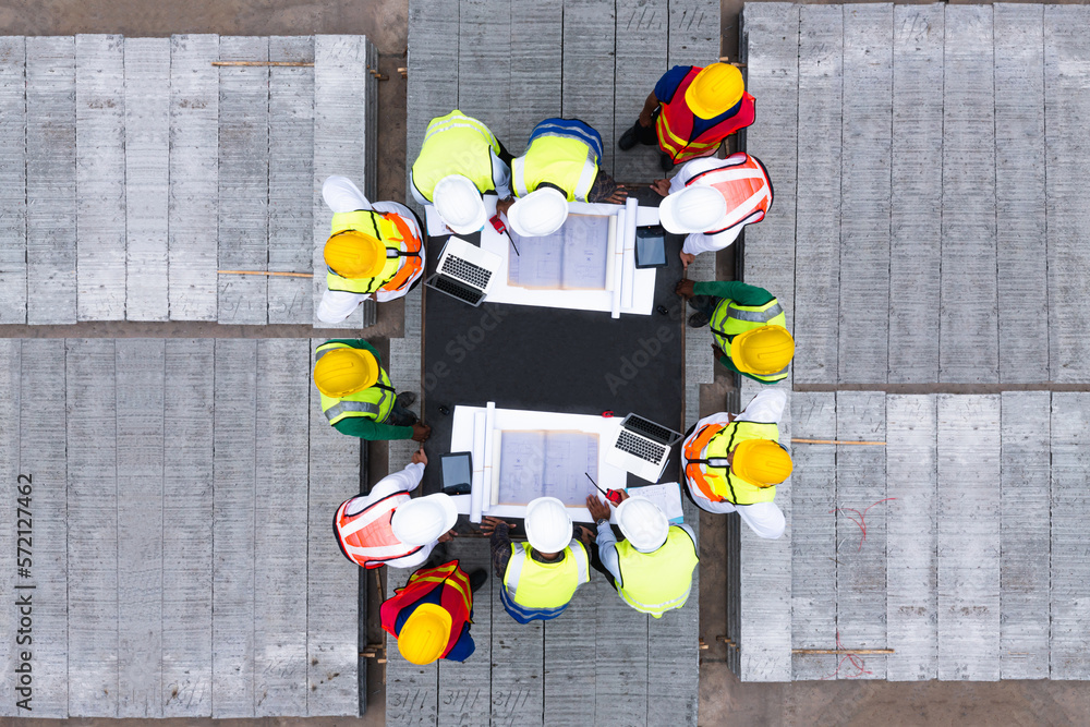 Top view of architectural engineering discussion at the table and his ...