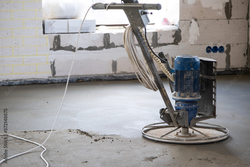 Ramming and grinding of semi-dry floor screed by a machine with a ...