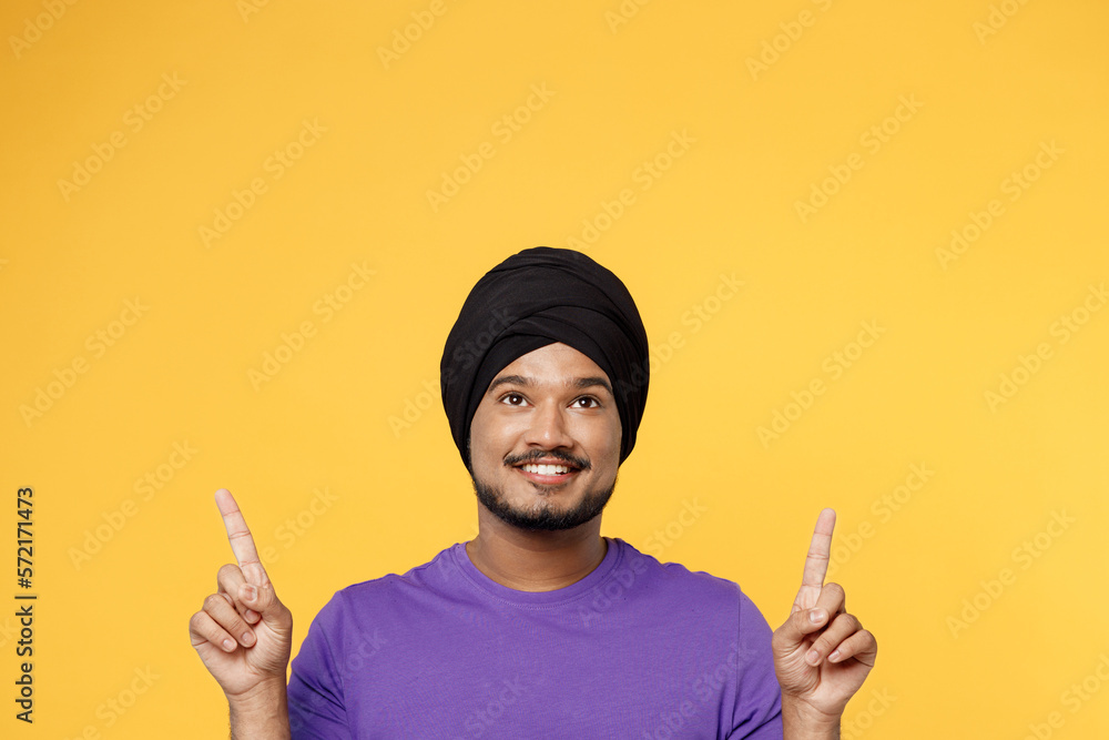 Happy devotee Sikh Indian man ties his traditional turban dastar wear ...