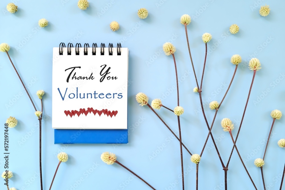 Thank You Volunteers message on blue notepad card with minimalist ...