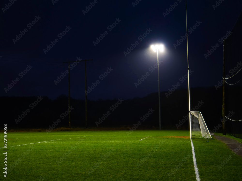 Training ground with grass illuminated by modern powerful LED lights ...