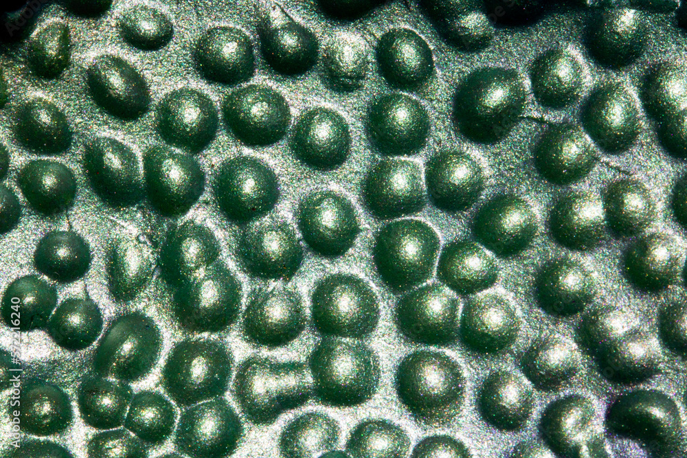 Alien trypophobia holes in a shiny sci-fi close up background Stock ...