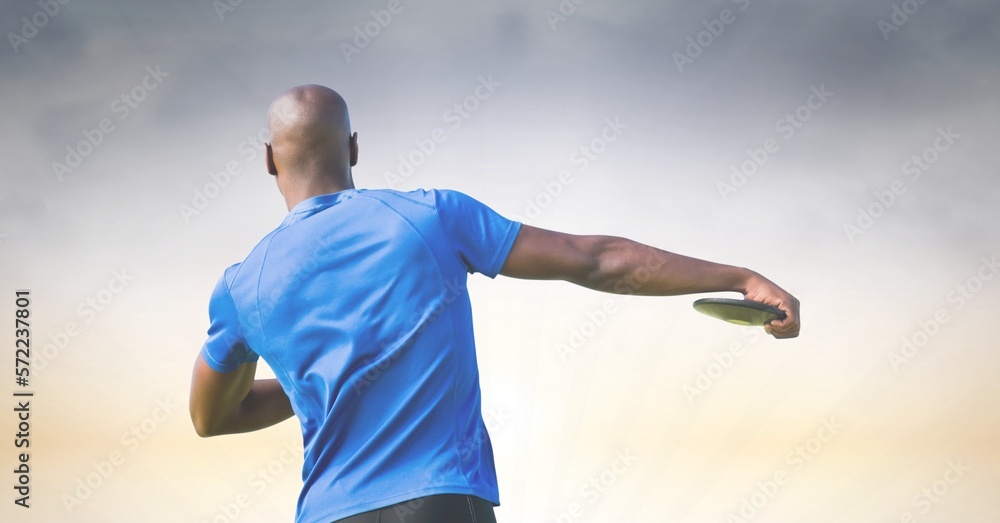 Composition of rear view of african american male athlete throwing ...
