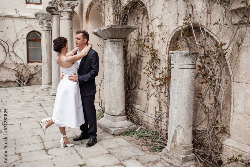 A couple in love, The bride and groom are dressed in a wedding suit and ...