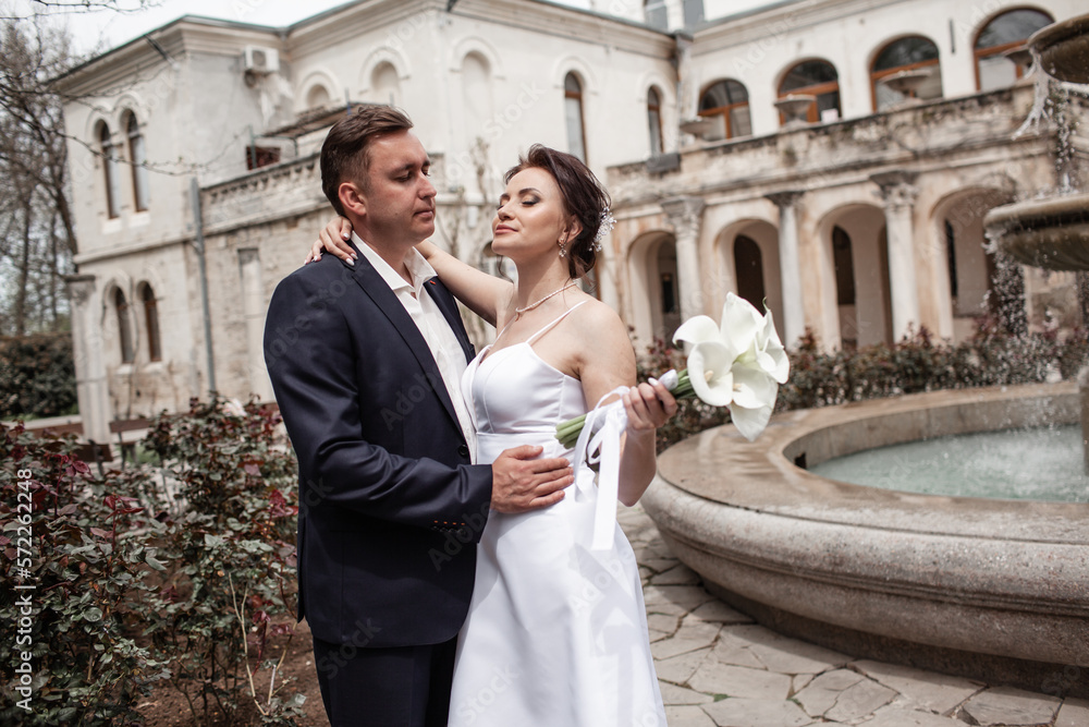 A couple in love, The bride and groom are dressed in a wedding suit and ...