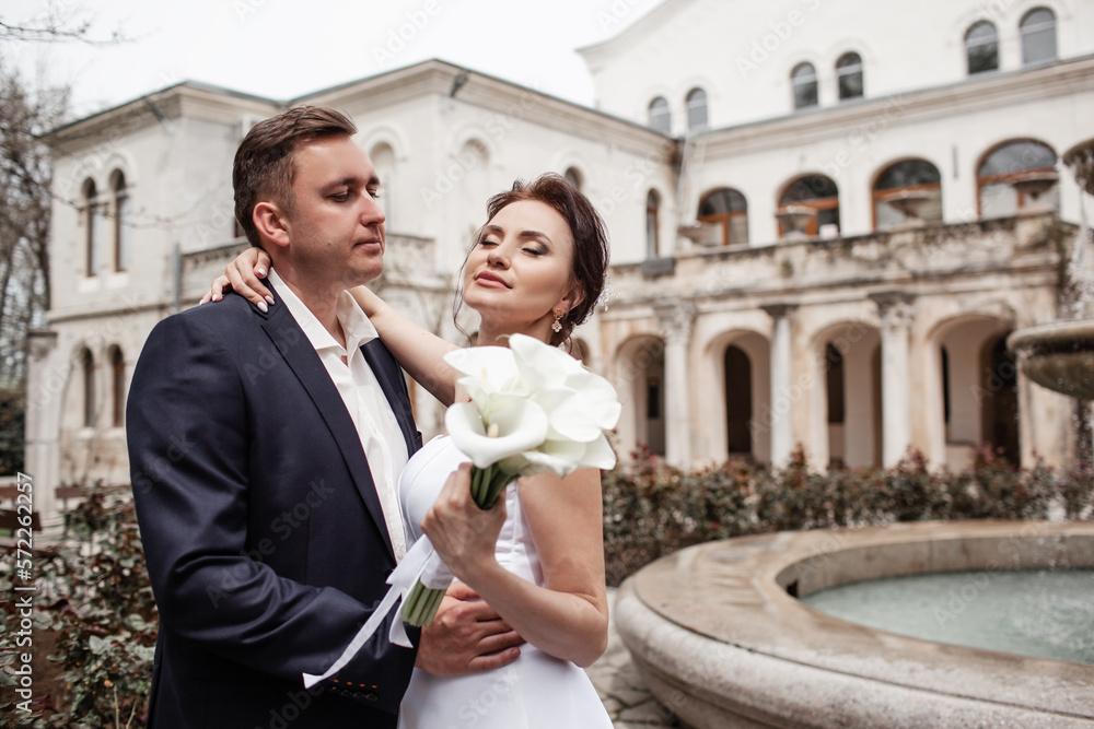 A couple in love, The bride and groom are dressed in a wedding suit and ...