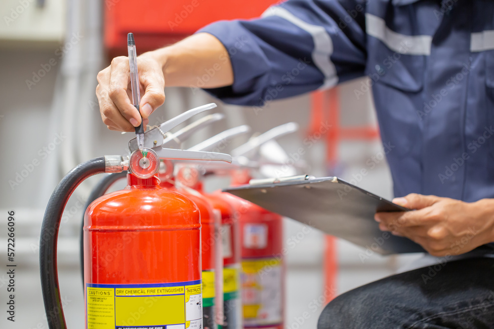 Engineer are checking and inspection a fire extinguishers tank in the ...