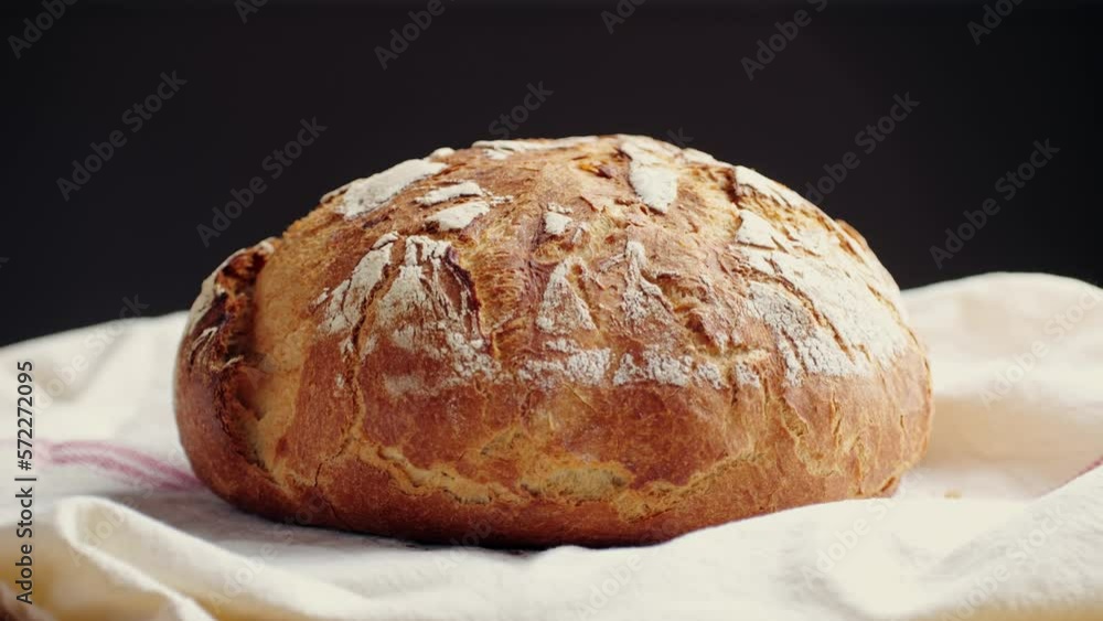Whole grain bread put on kitchen wood plate by the chef in bakery ...