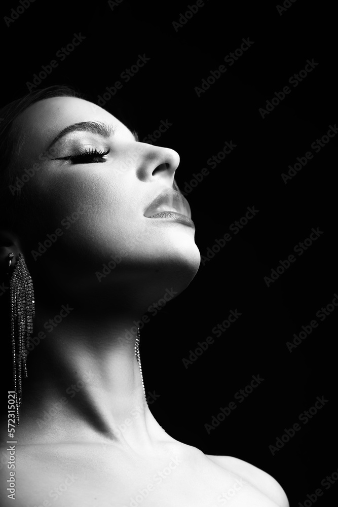 Fashion and make-up concept. Beautiful woman studio portrait with fancy ...