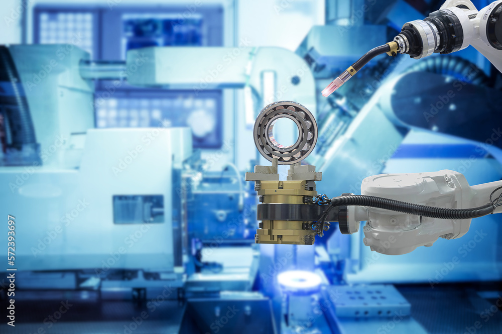 Close-up industrial welding robotics working with metalwork from ...