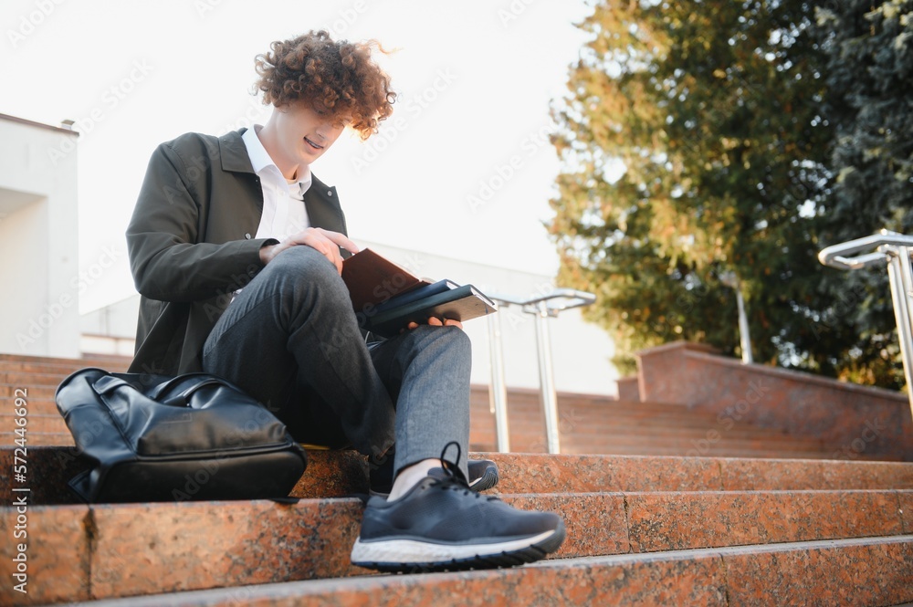 Excited student having break between classes near university, smiling ...