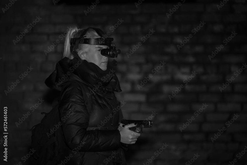 Black and white photo. Girl detective with a night vision device on her ...